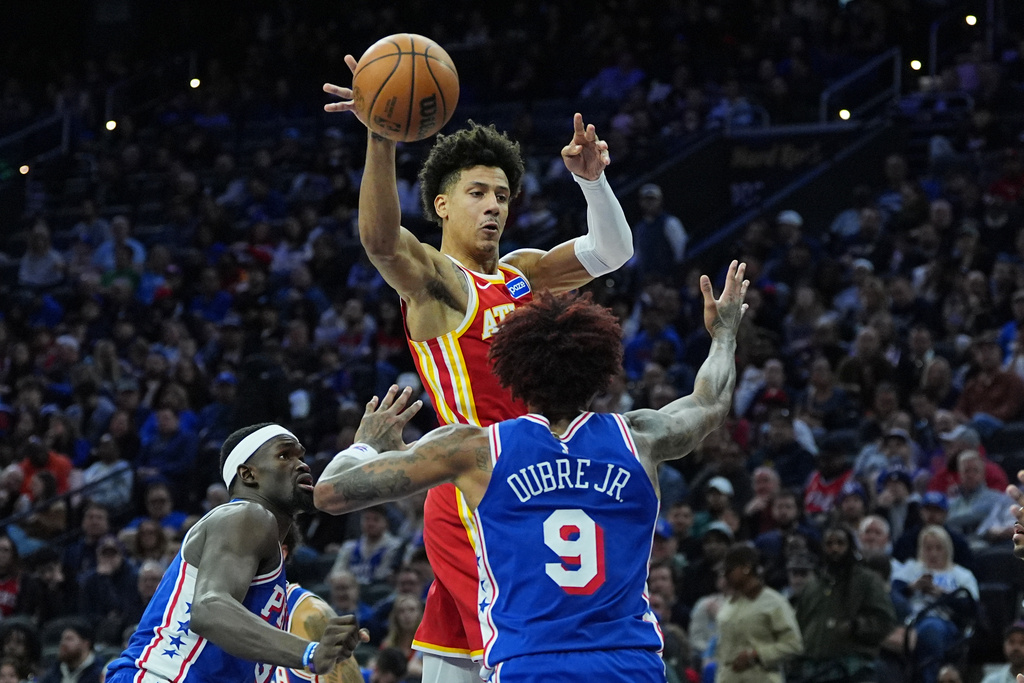 Johnson and McCollum power Hawks past the 76ers 117-107 as Atlanta ...