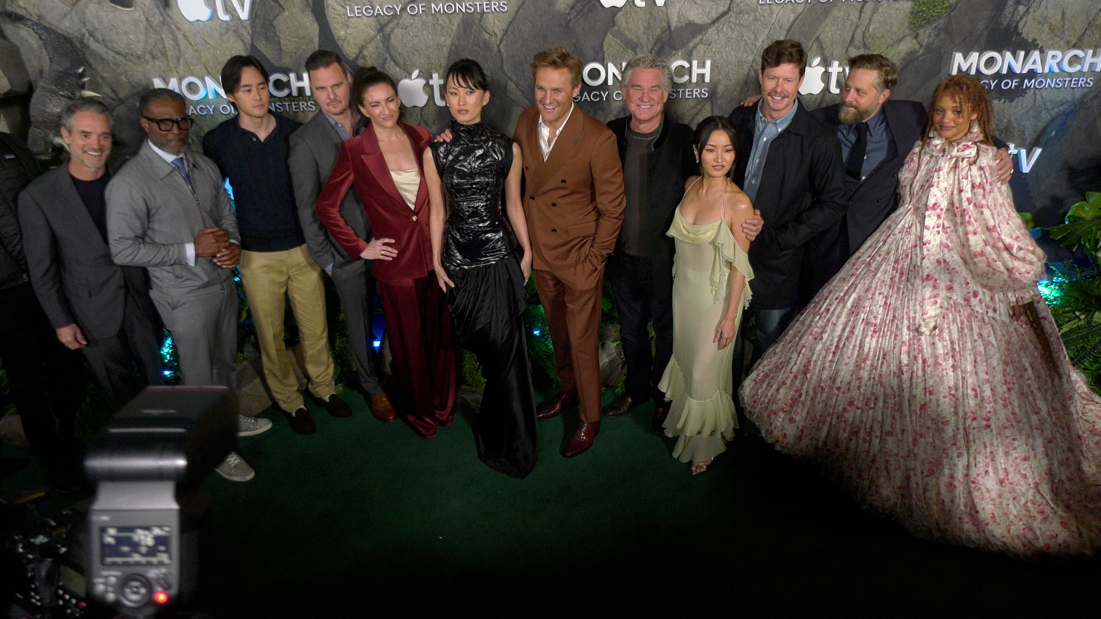 The cast of season 2 of “Monarch: Legacy of Monsters” poses together at ...