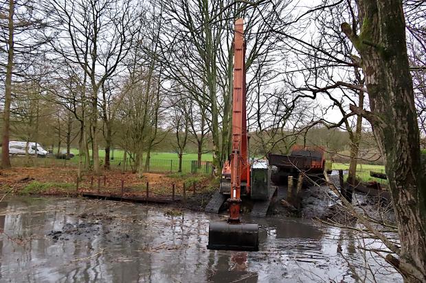The reason for the large digger in one of Bolton's most popular parks