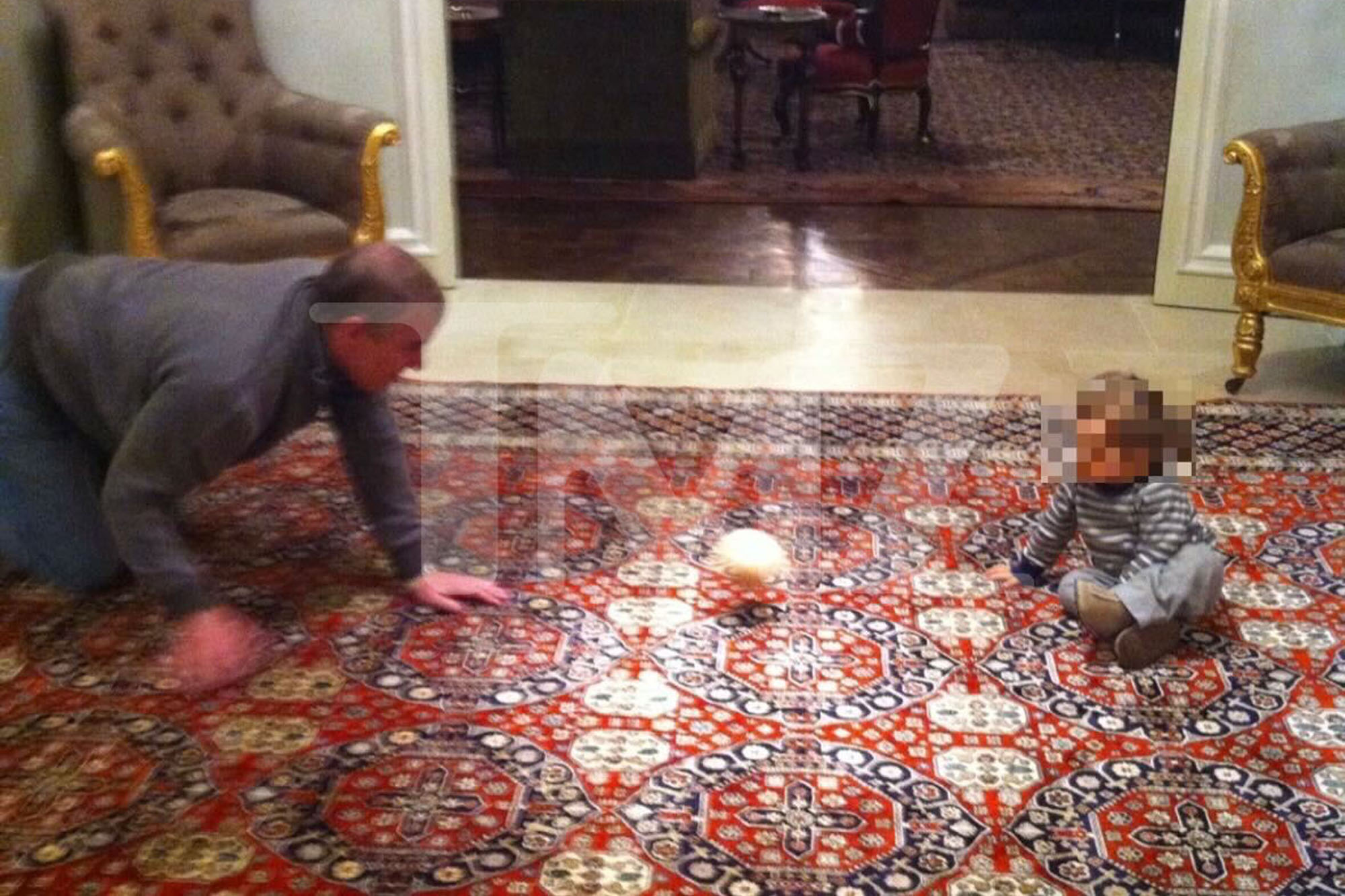 Bizarre photos show ex-Prince Andrew playing with young boy — using a ...