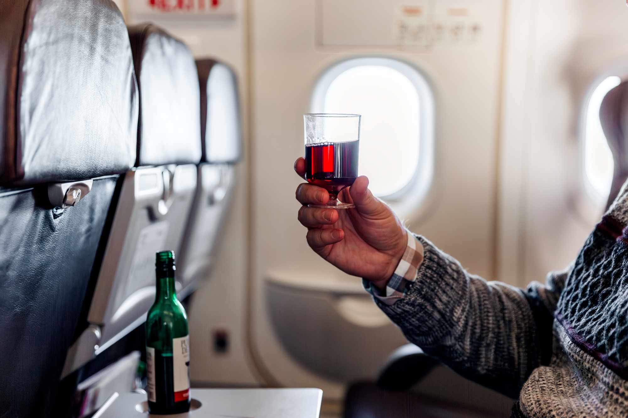 We asked 6 wine experts what they drink on a flight, and they all agree ...