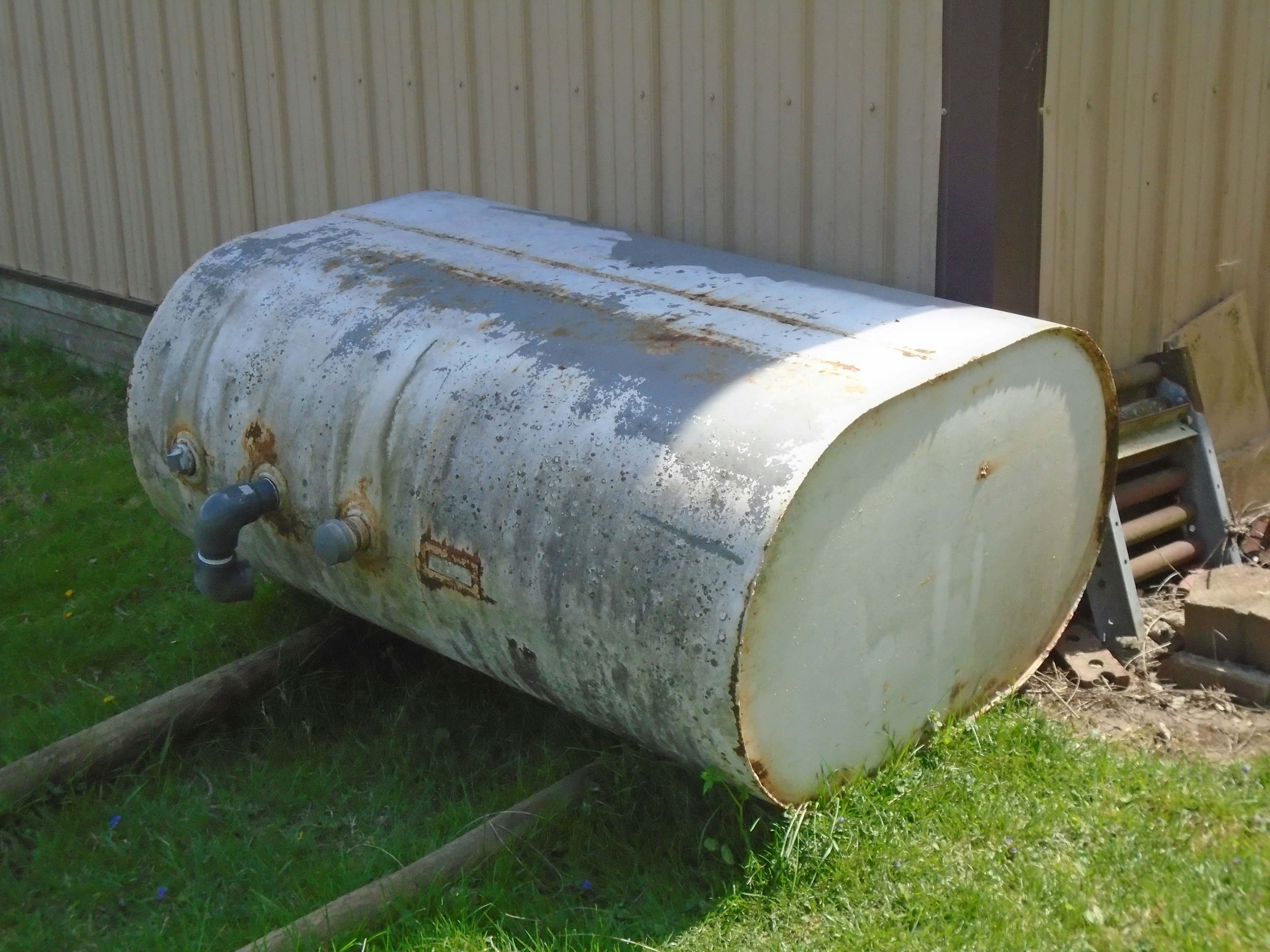 When should professionals remove an oil tank in the basement?