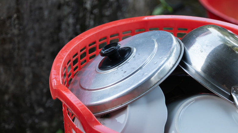 Turn old pot lids into an artsy garden feature with an easy DIY
