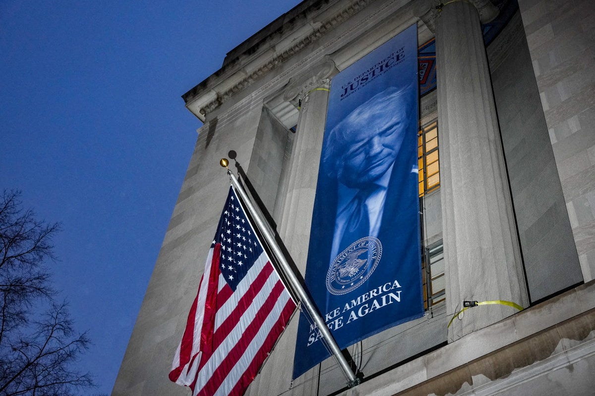Banner of Donald Trump unfurled at Justice Department headquarters