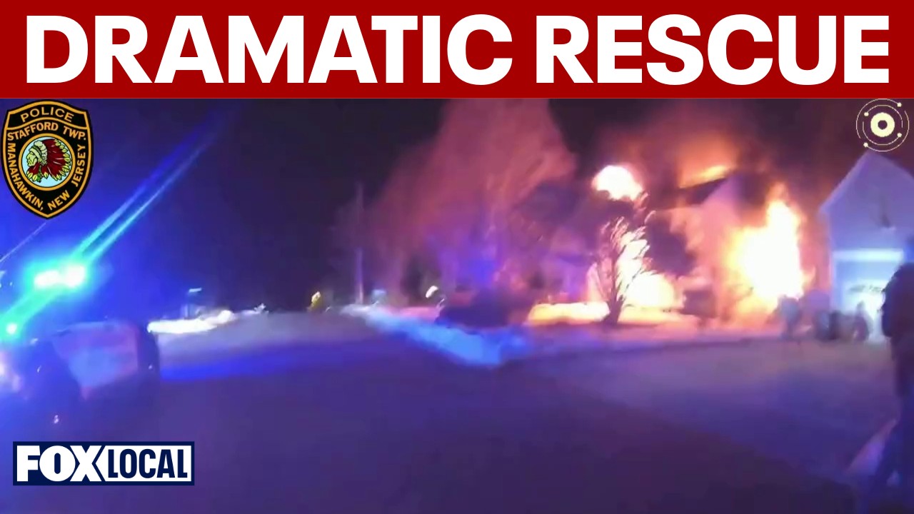 NJ police catch man jumping from burning building