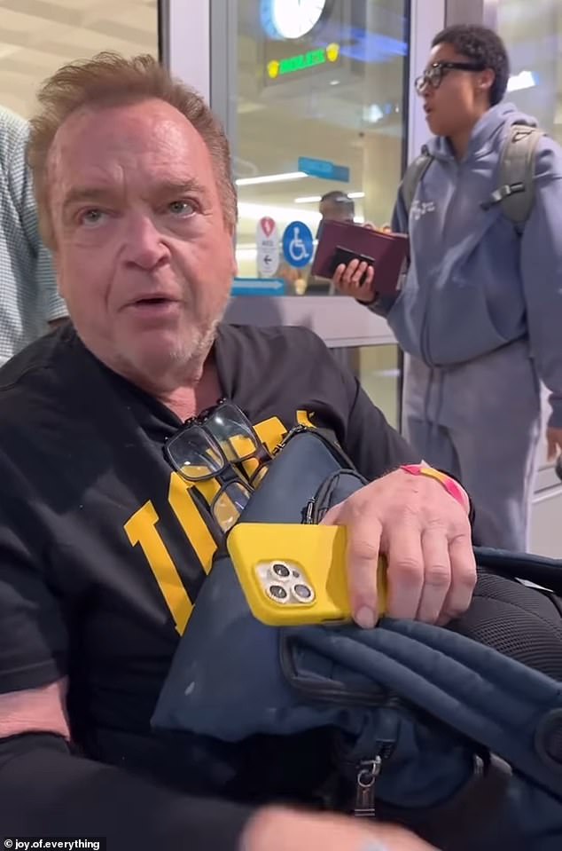 Tom Arnold, 66, seen in wheelchair as he says he 'broke his back ...