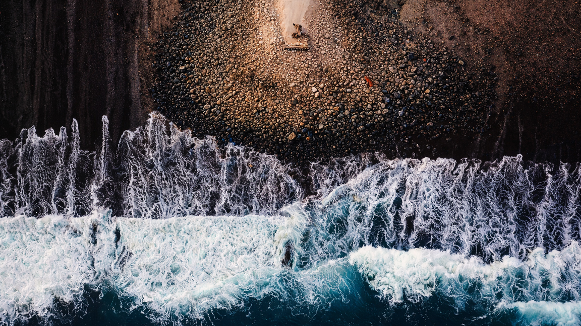 Waves crashing on rocky shore