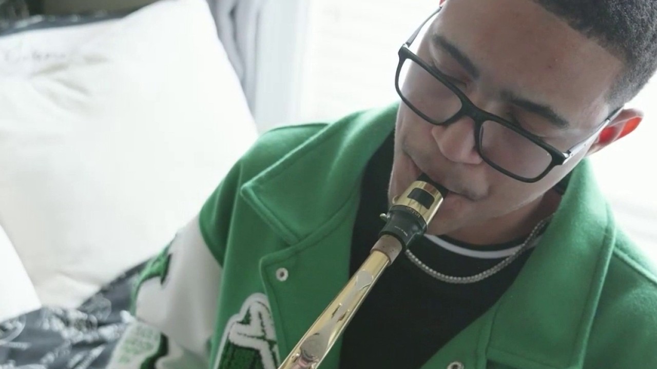 Teen beats rare cancer with strength and saxophone