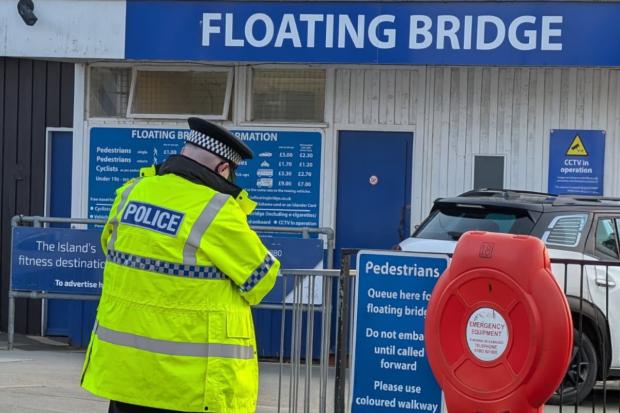 Why has there been a 'large police presence' at Cowes Floating Bridge?