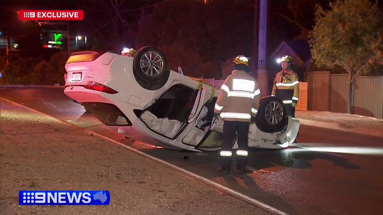 CCTV shows Adelaide carjacker walk away from crash after flipping car ...