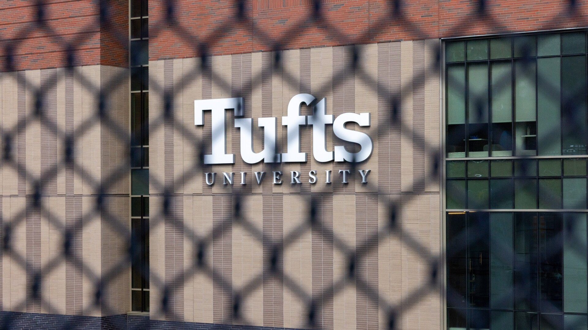 Tufts, which has a building named for Steve Tisch, is monitoring ...