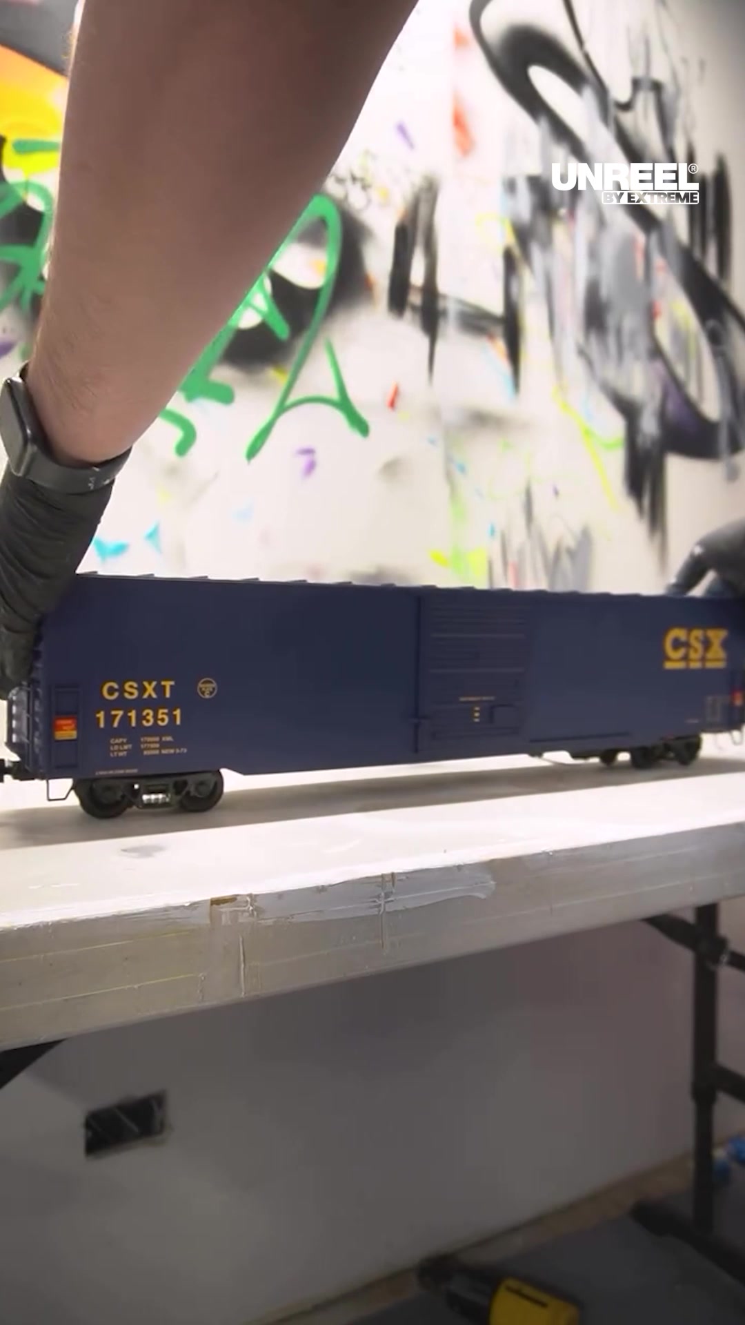 Transforming miniature trains into graffiti masterpieces: A stunning ...