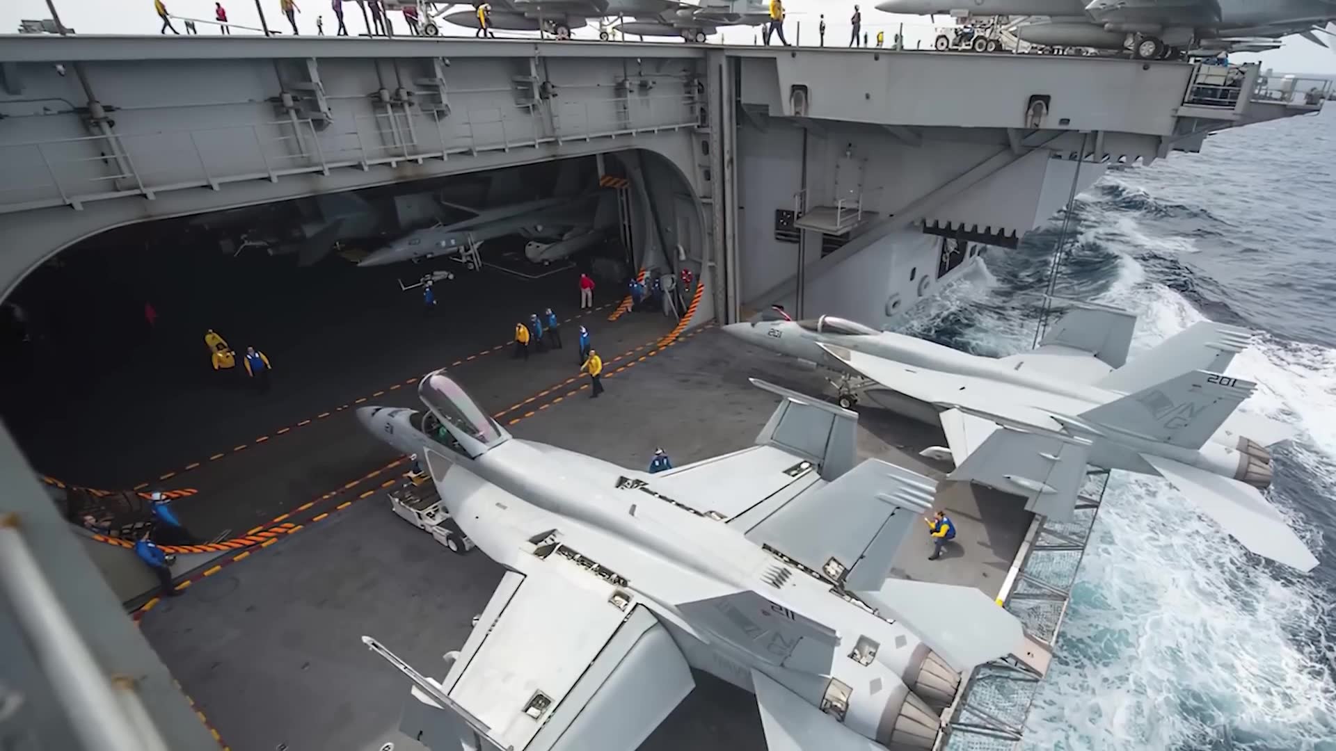 Elevator systems move aircraft between decks