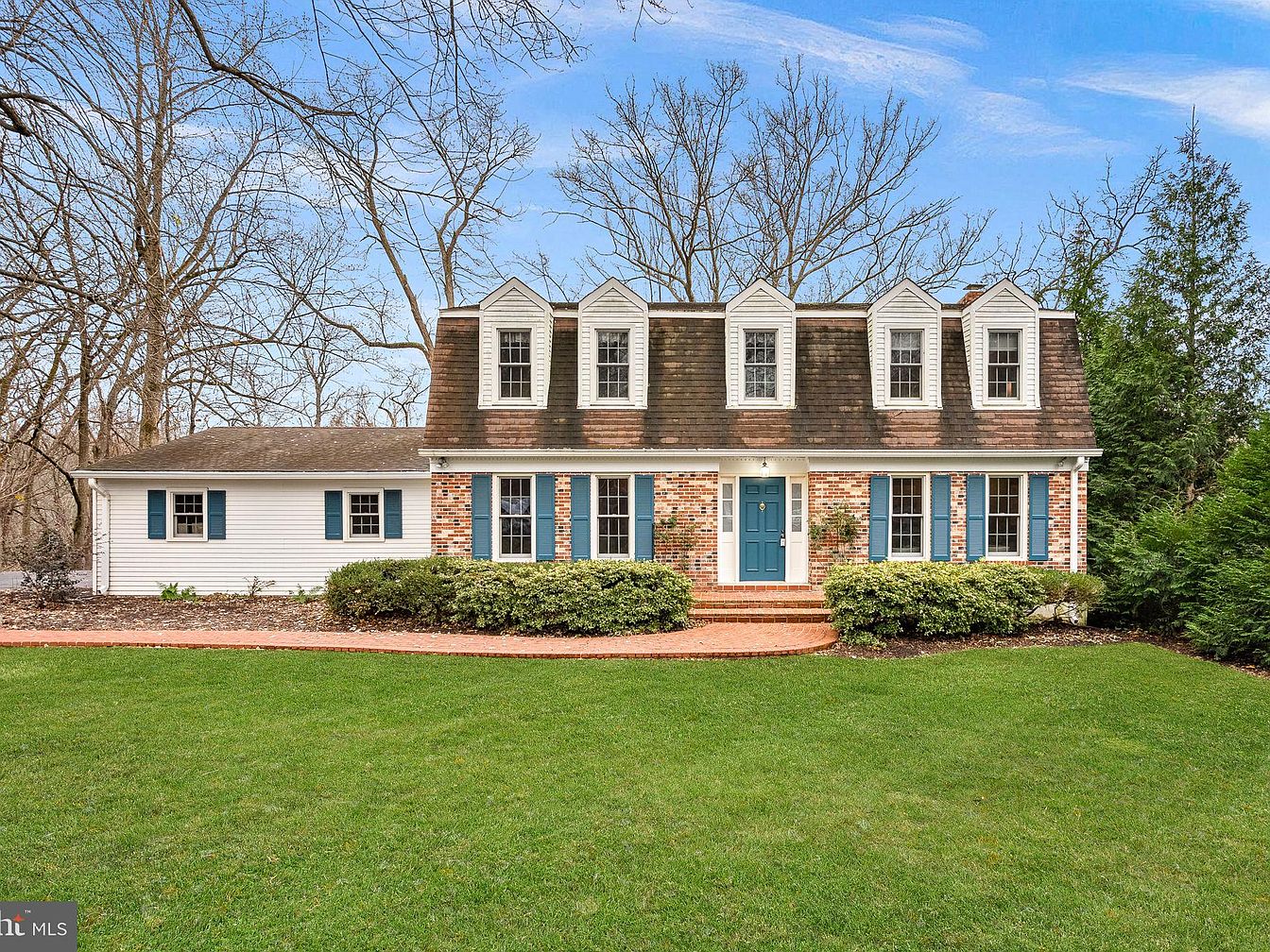 Step into a 1976 colonial gem in Great Falls, Virginia, featuring a ...