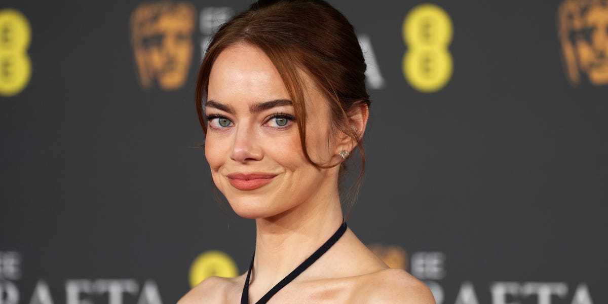 Emma Stone keeps it simple and chic in a black Louis Vuitton dress at ...