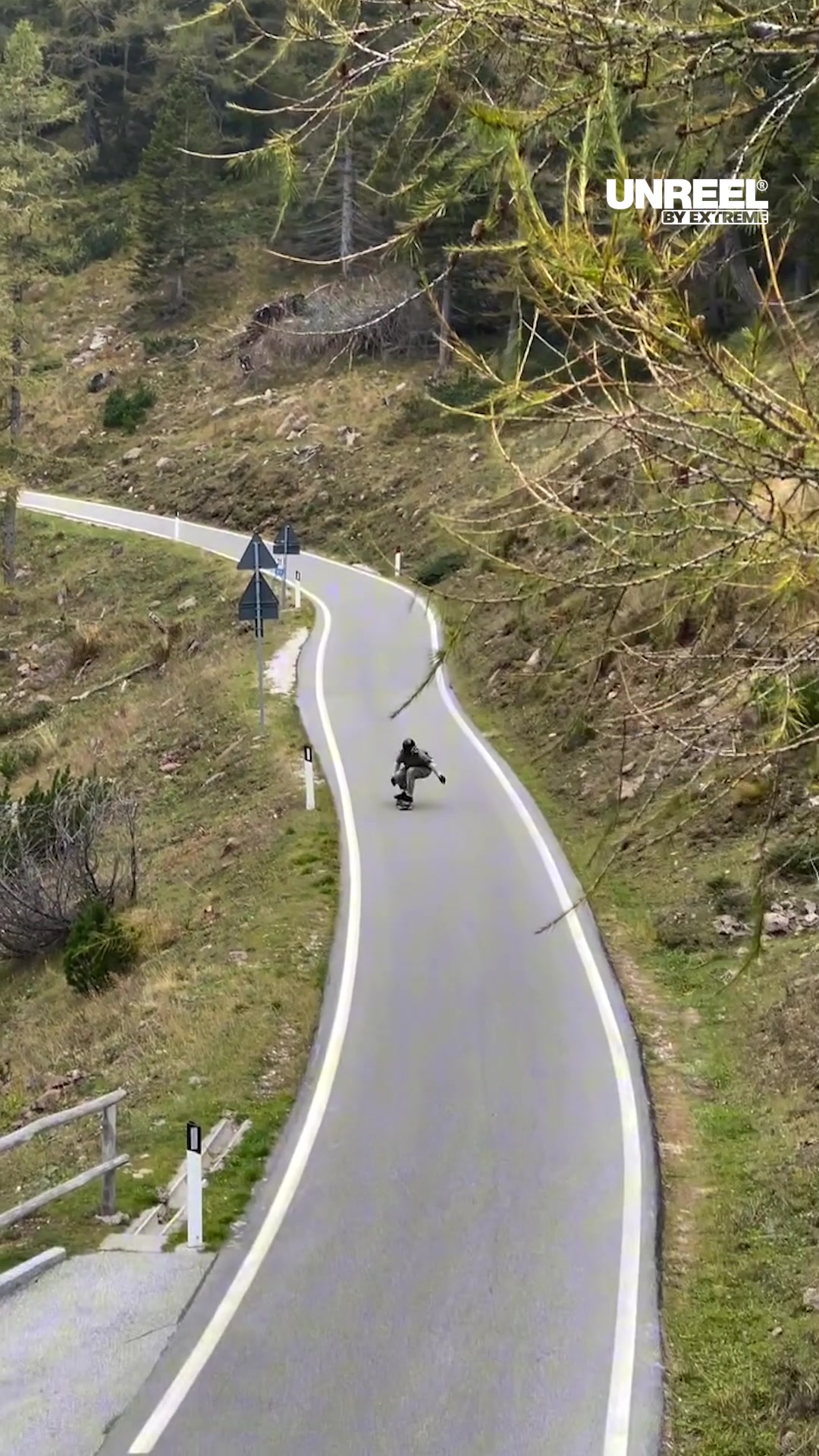 Thrilling longboard descent through scenic forest roads!
