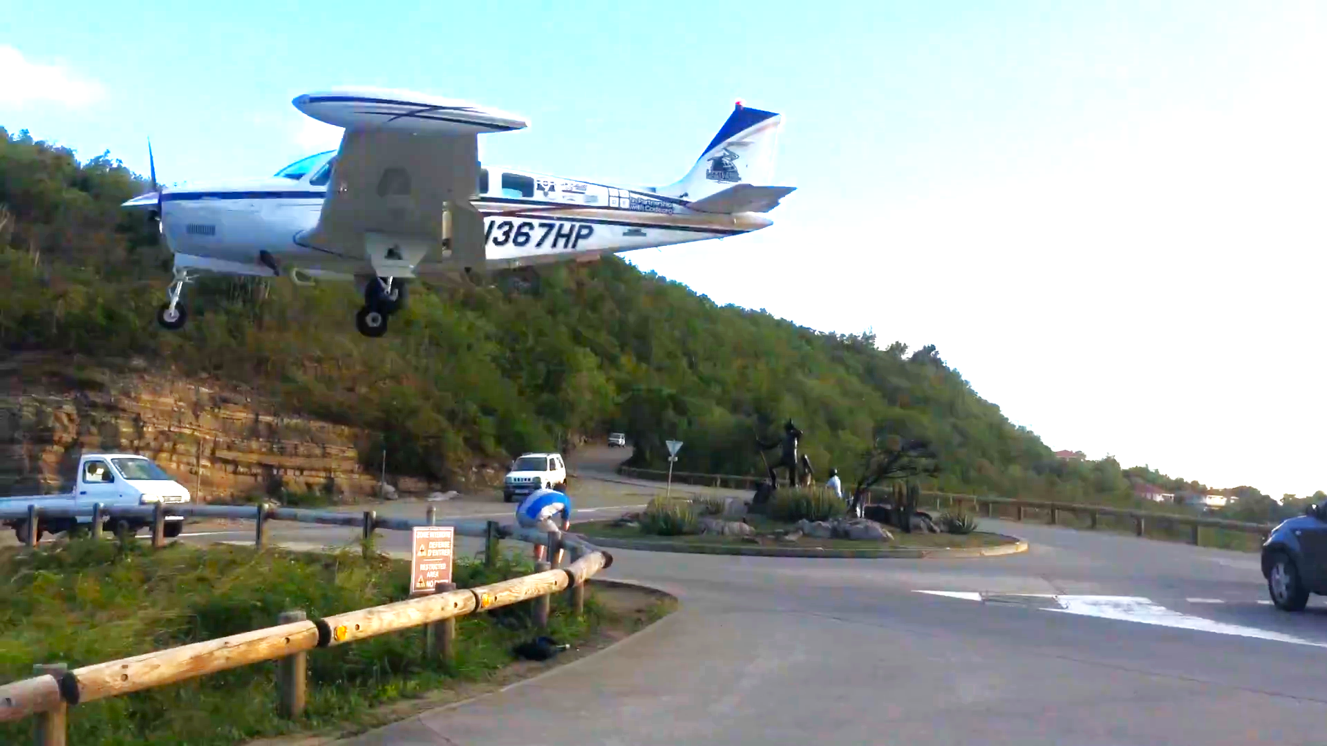 Watch this plane drop just feet above people before a heart stopping ...
