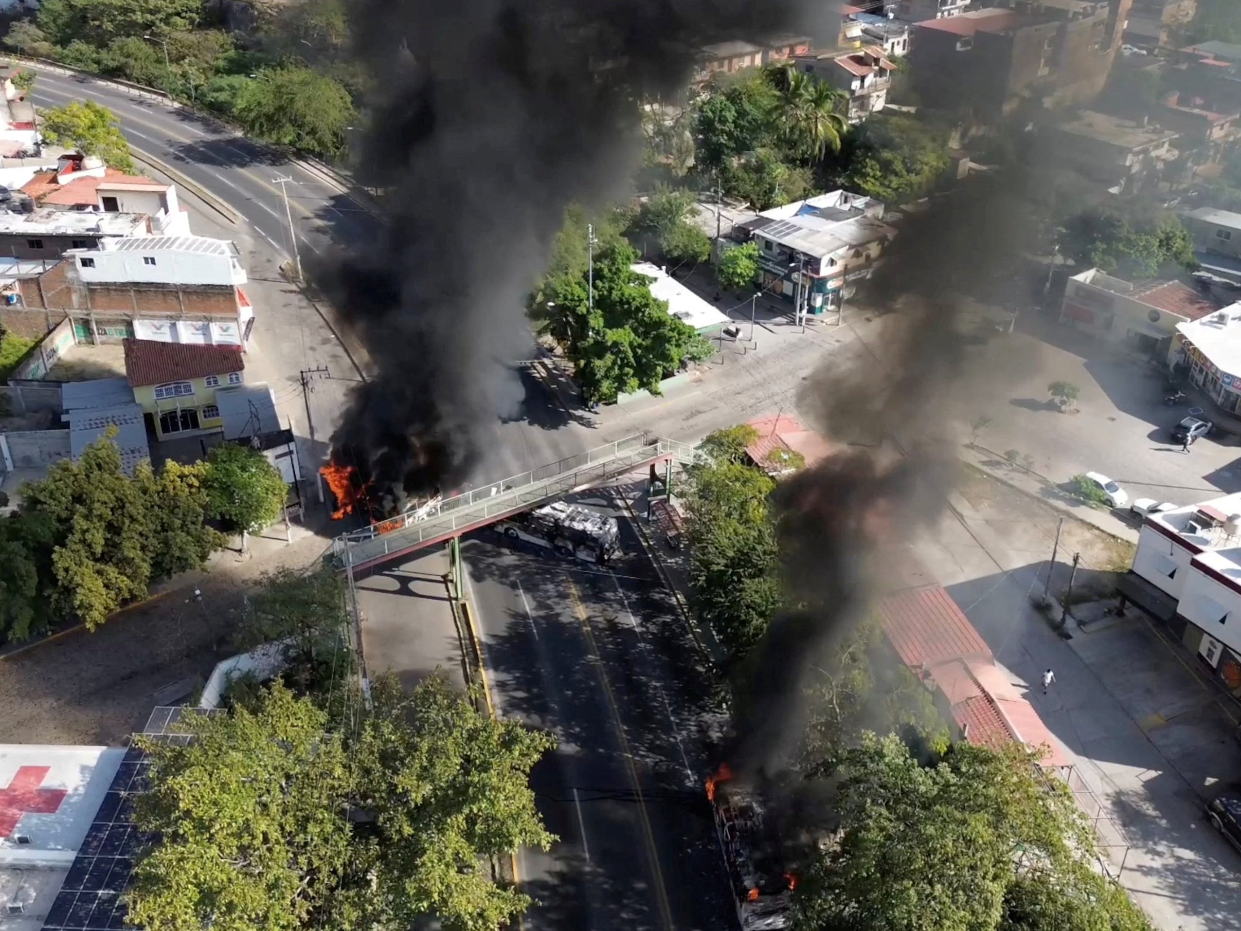 Photos show burned-out cars, empty streets, and airport chaos in Mexico ...
