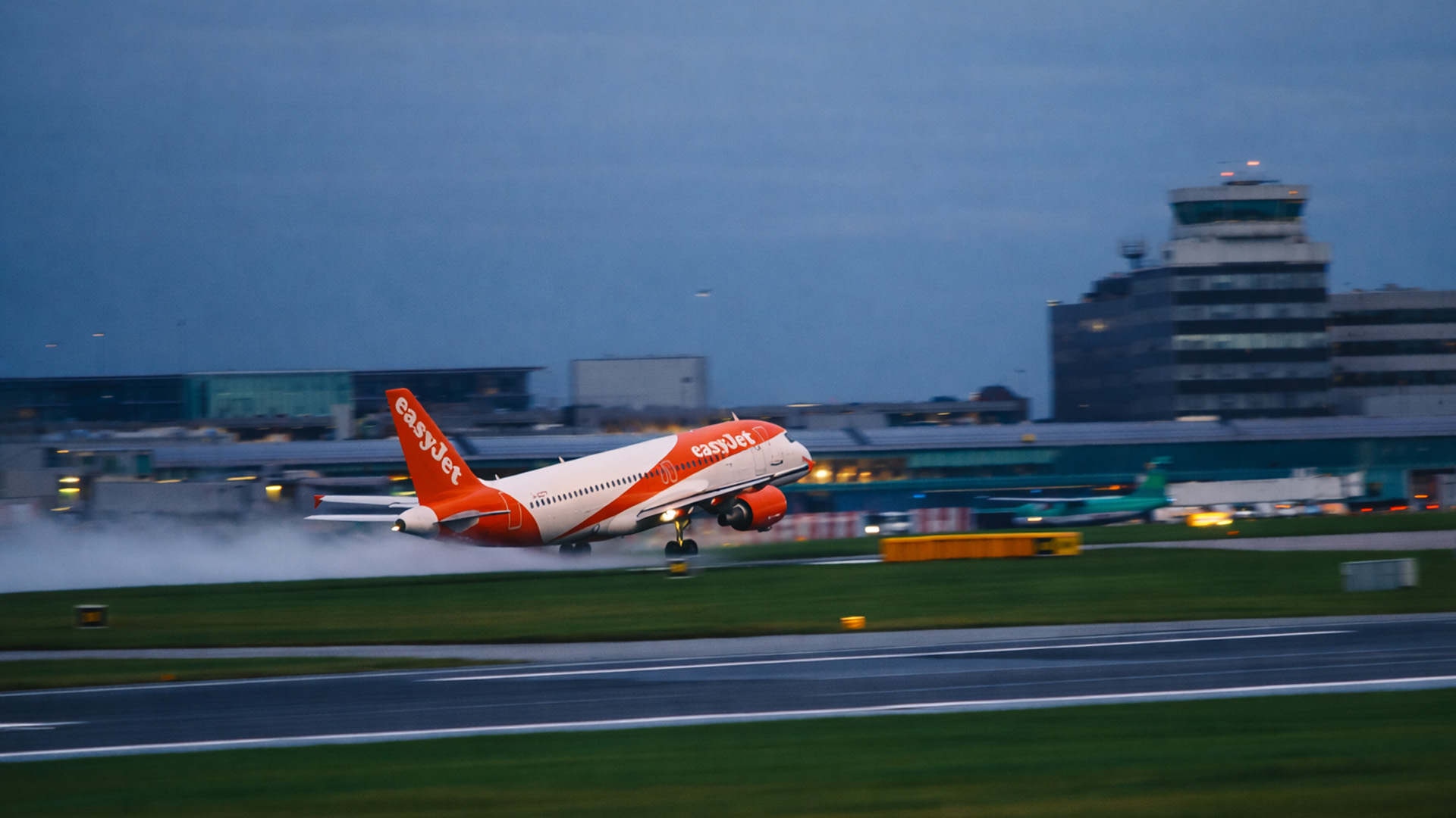Jets lift off through heavy runway spray