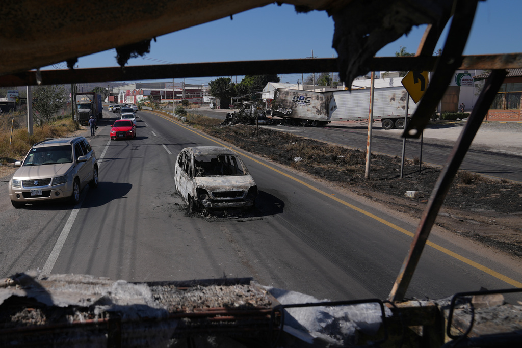 Security forces keep up fight with cartel gunmen a day after the ...