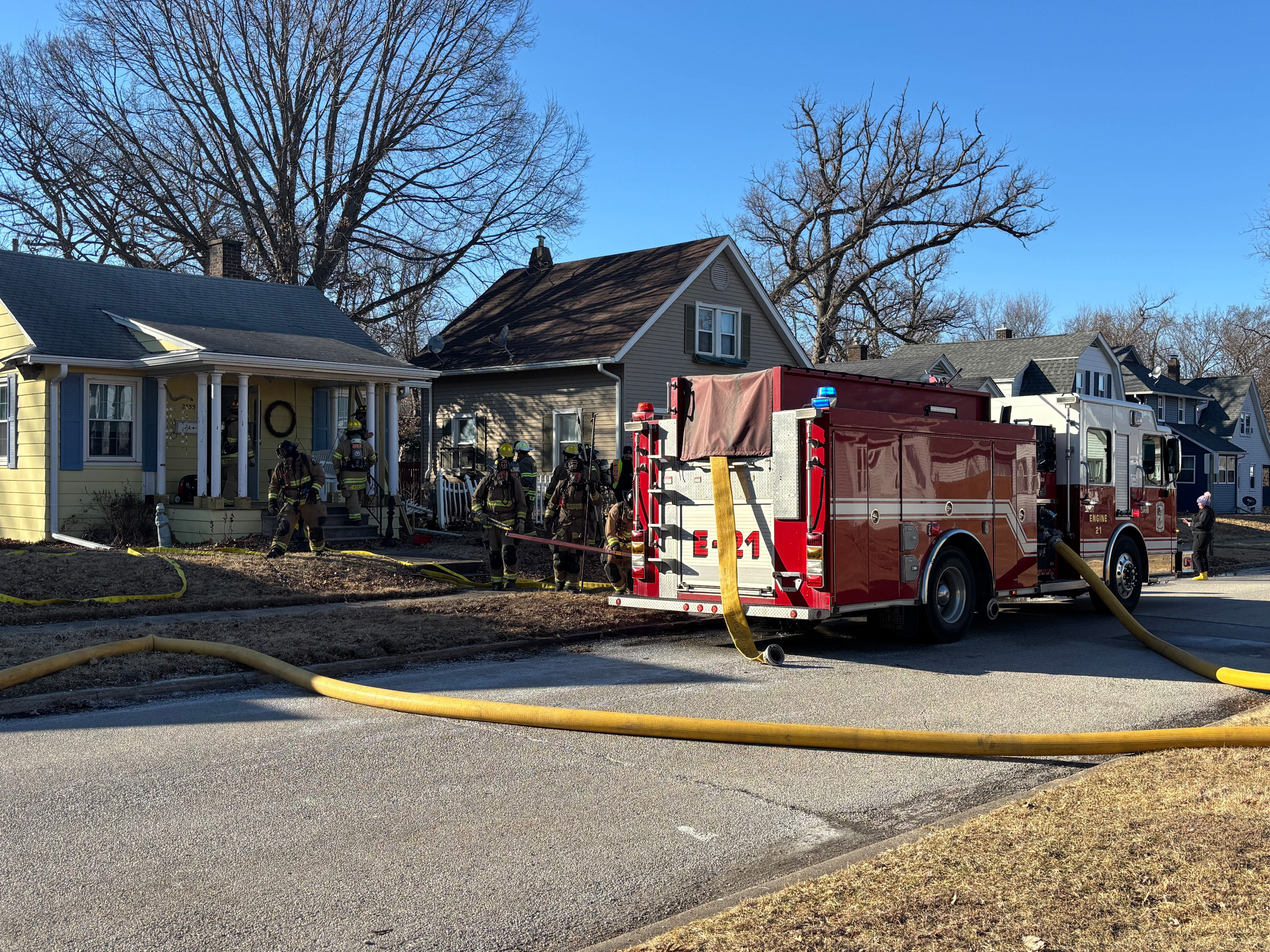 Crews fight East Moline house fire, sparked from leaf burning
