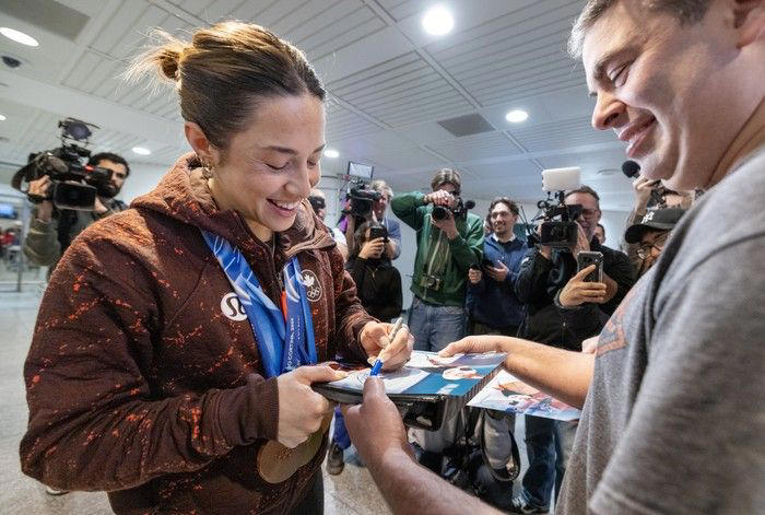 Quebec Olympians arrive at Trudeau airport wearing their medals and ...