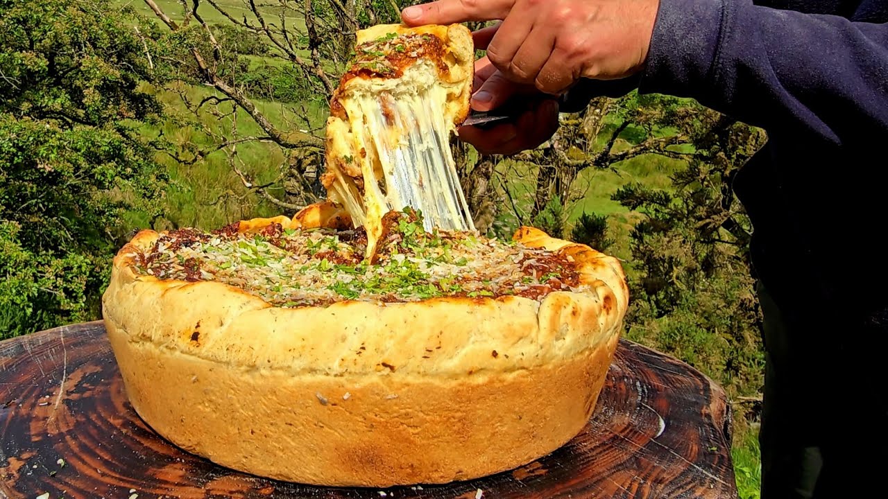 That first cut into deep dish… and the cheese won’t stop
