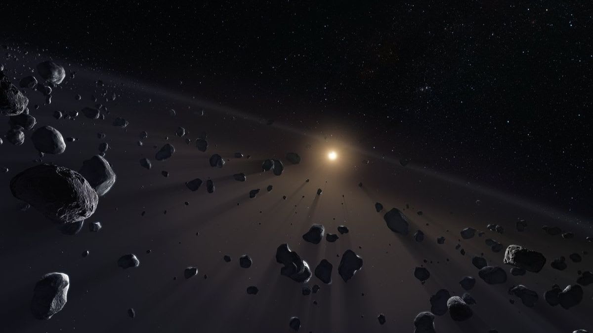 A massive, unseen object may lurk deep inside the Kuiper Belt