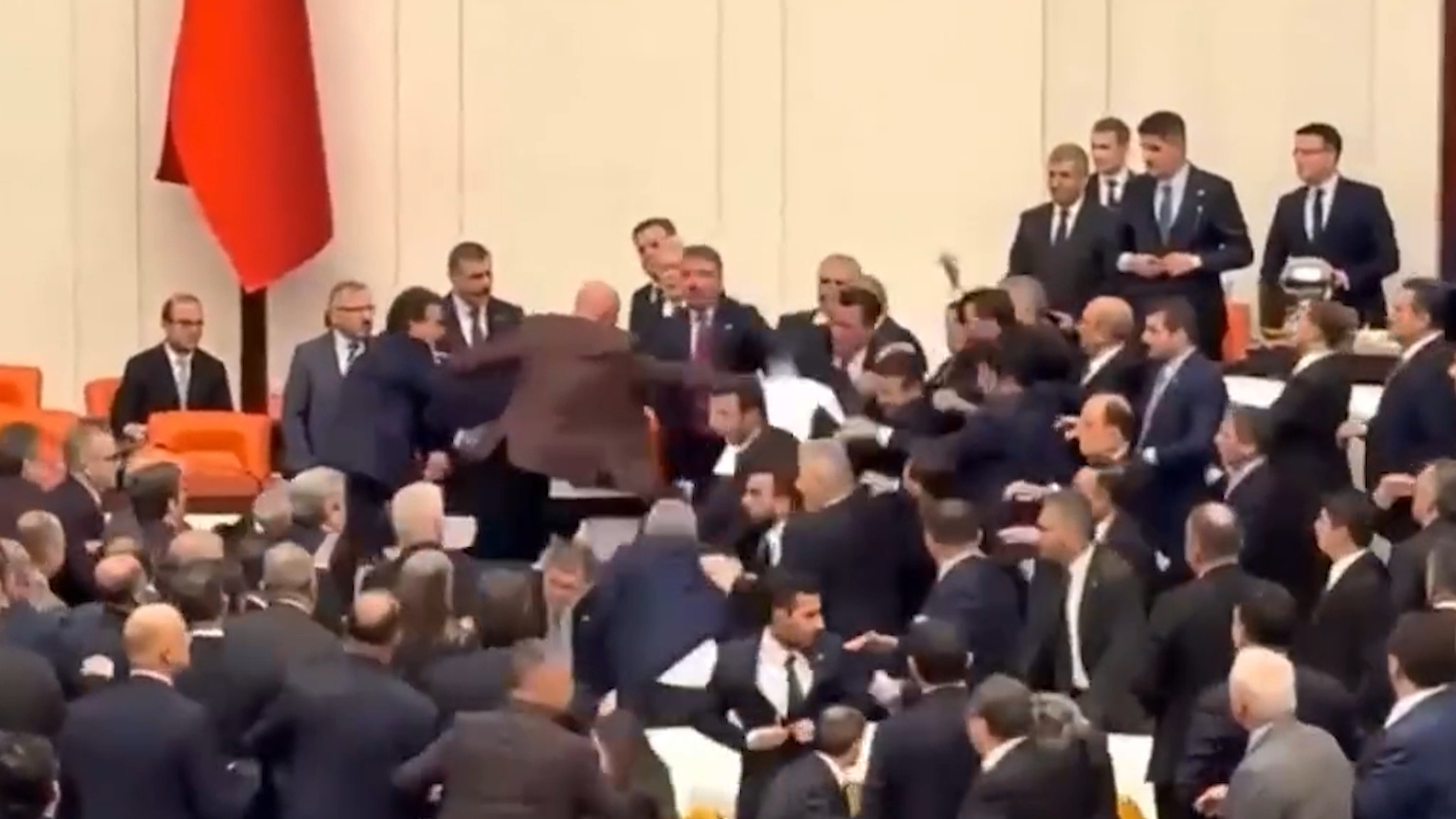Punches thrown by politicians in chaotic brawl in parliament