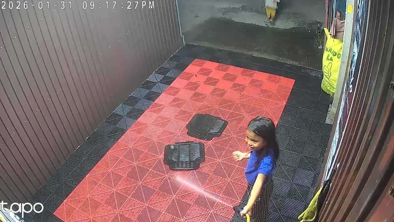 Young girl hurt her hand while playing with a high-pressure hose at car ...