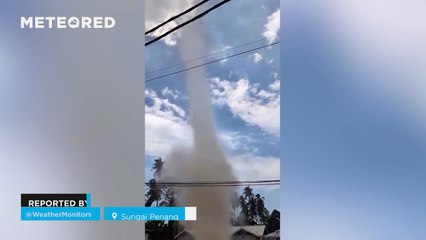 A large dust devil leaves striking images in Sungai Penang, Malaysia