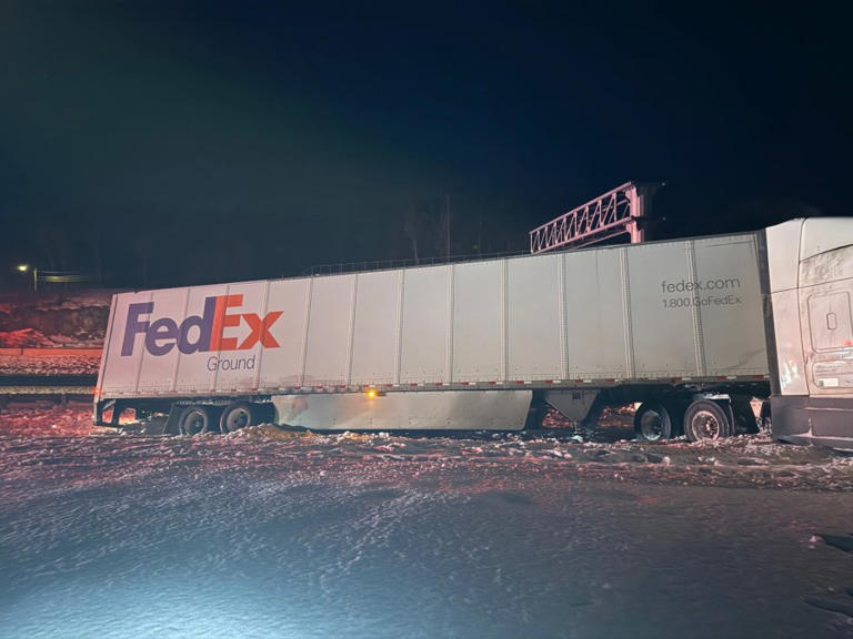 Traffic slowed after FedEx tractor-trailer crashes off I-84 in Tolland