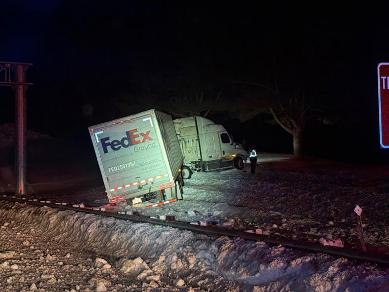 Traffic slowed after FedEx tractor-trailer crashes off I-84 in Tolland