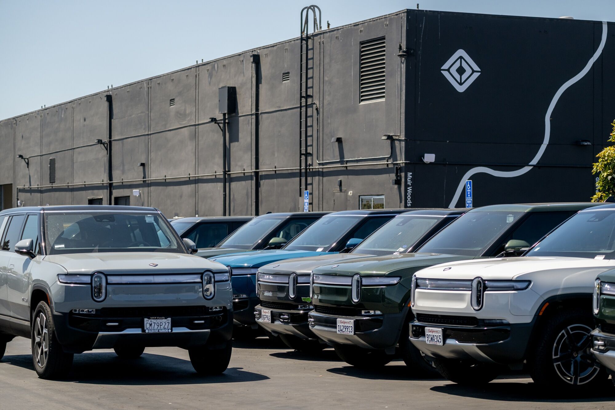 Rivian posts smaller-than-expected loss ahead of next EV debut