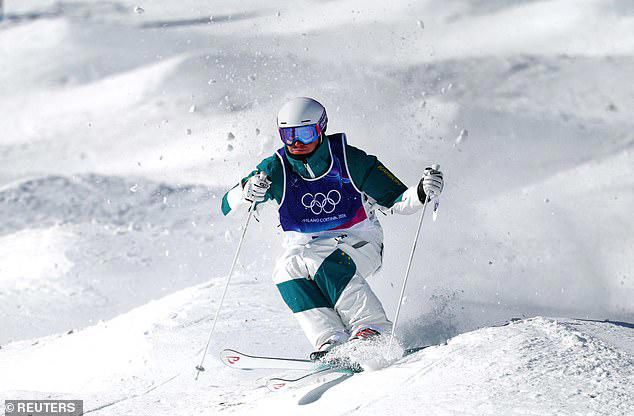 Australian Cooper Woods stuns the world to win gold in men's moguls at ...