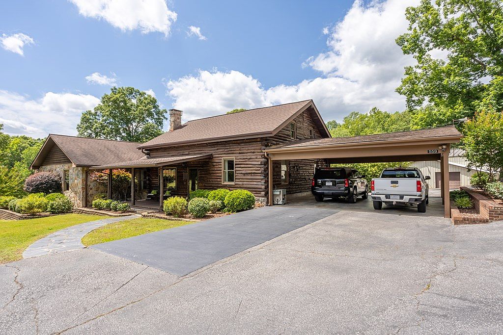 1984 log cabin estate in Chase City, Virginia, nestled on 45 acres with ...