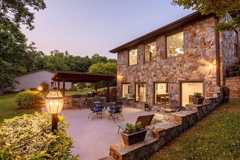 1984 log cabin estate in Chase City, Virginia, nestled on 45 acres with ...