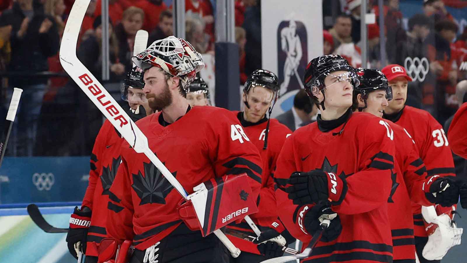 Fans throw beer cups on ice during Switzerland-Canada Olympics clash