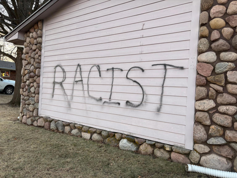 Refugee nonprofit director's home graffitied with 'Racist'
