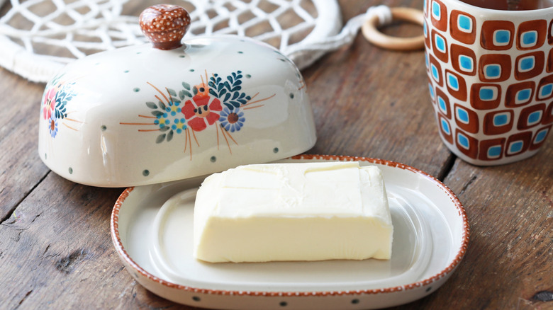 Turn an old butter dish into the perfect catch-all tray for your entryway