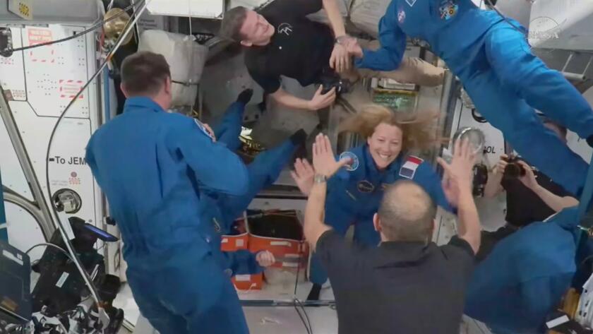 Four astronauts arrive at the International Space Station to replace ...