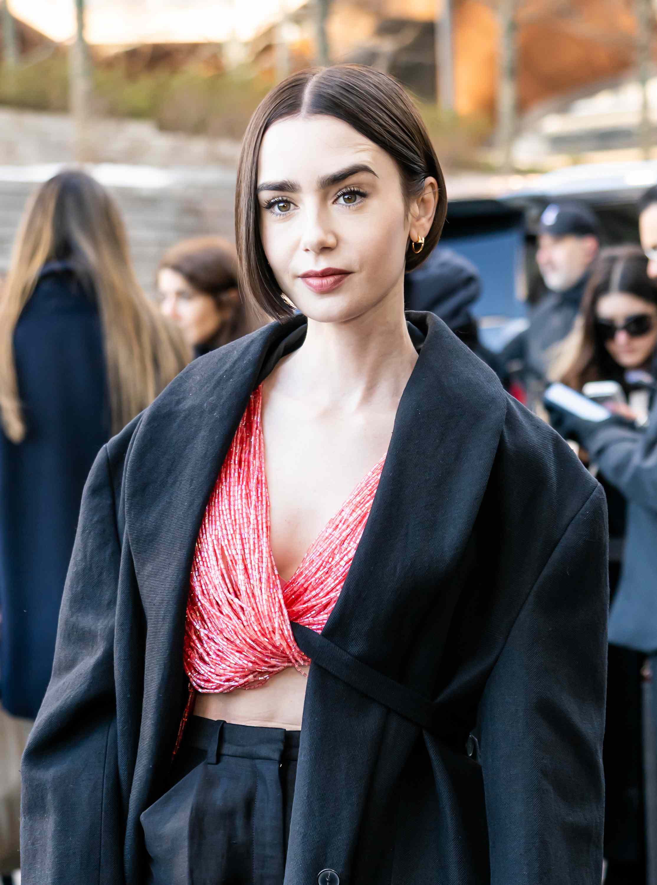 Lily Collins's daring crop top is made of nothing but hot pink beaded ...