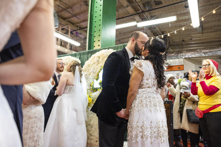 Seven couples tied the knot at Reading Terminal Market for a very ...