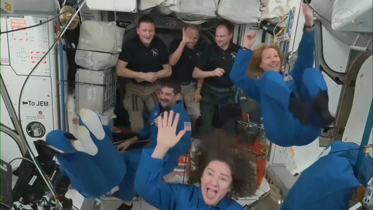 Four new astronauts arrive at the International Space Station to ...