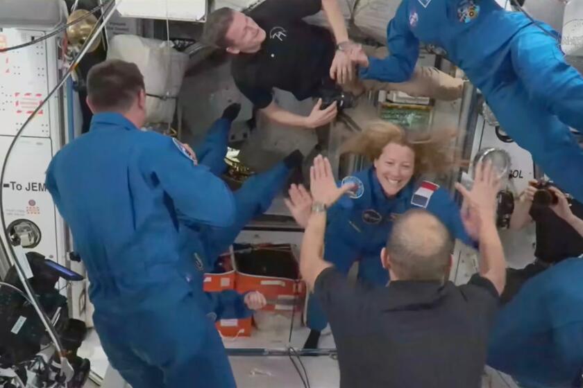 Four astronauts arrive at the International Space Station to replace ...