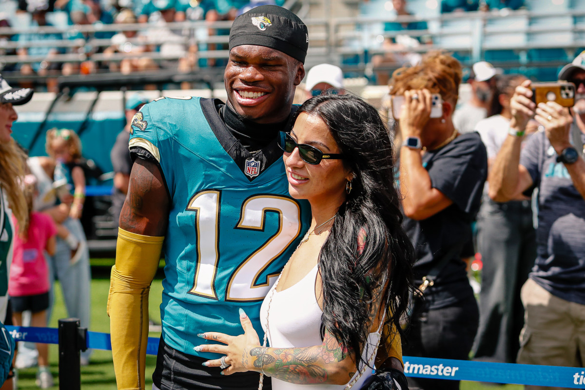 Travis Hunter's wife receives message from Angel Reese during vacation