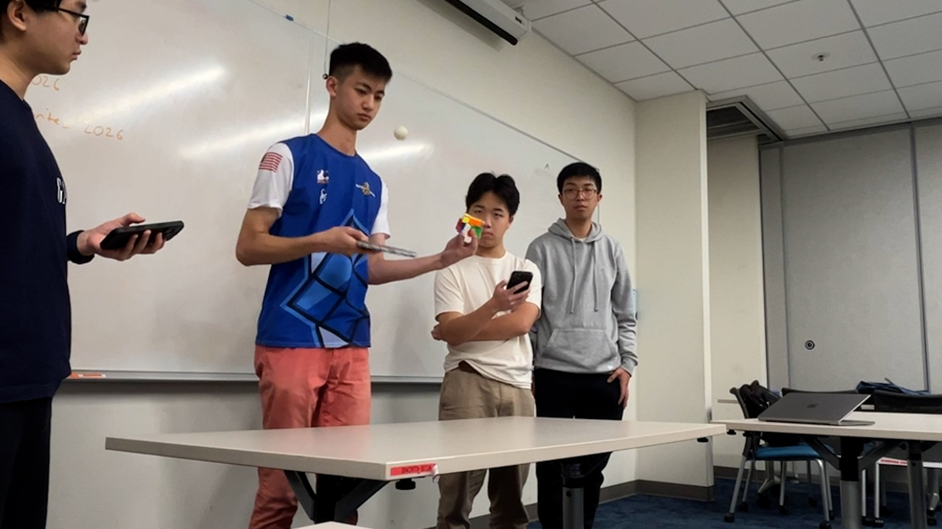Fastest time to solve a rotating puzzle cube while controlling a table ...