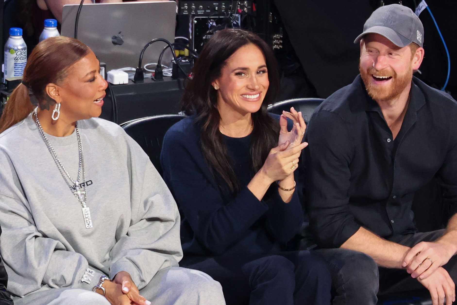 Meghan Markle and Prince Harry sit courtside next to Queen Latifah at ...