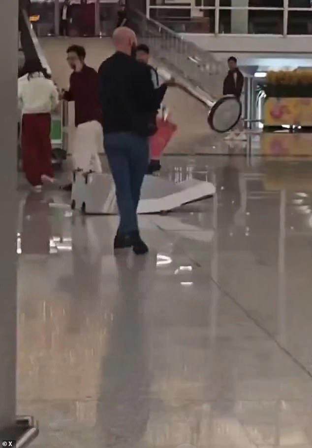 Moment raging Brit, 35, loses control at Hong Kong airport using metal ...