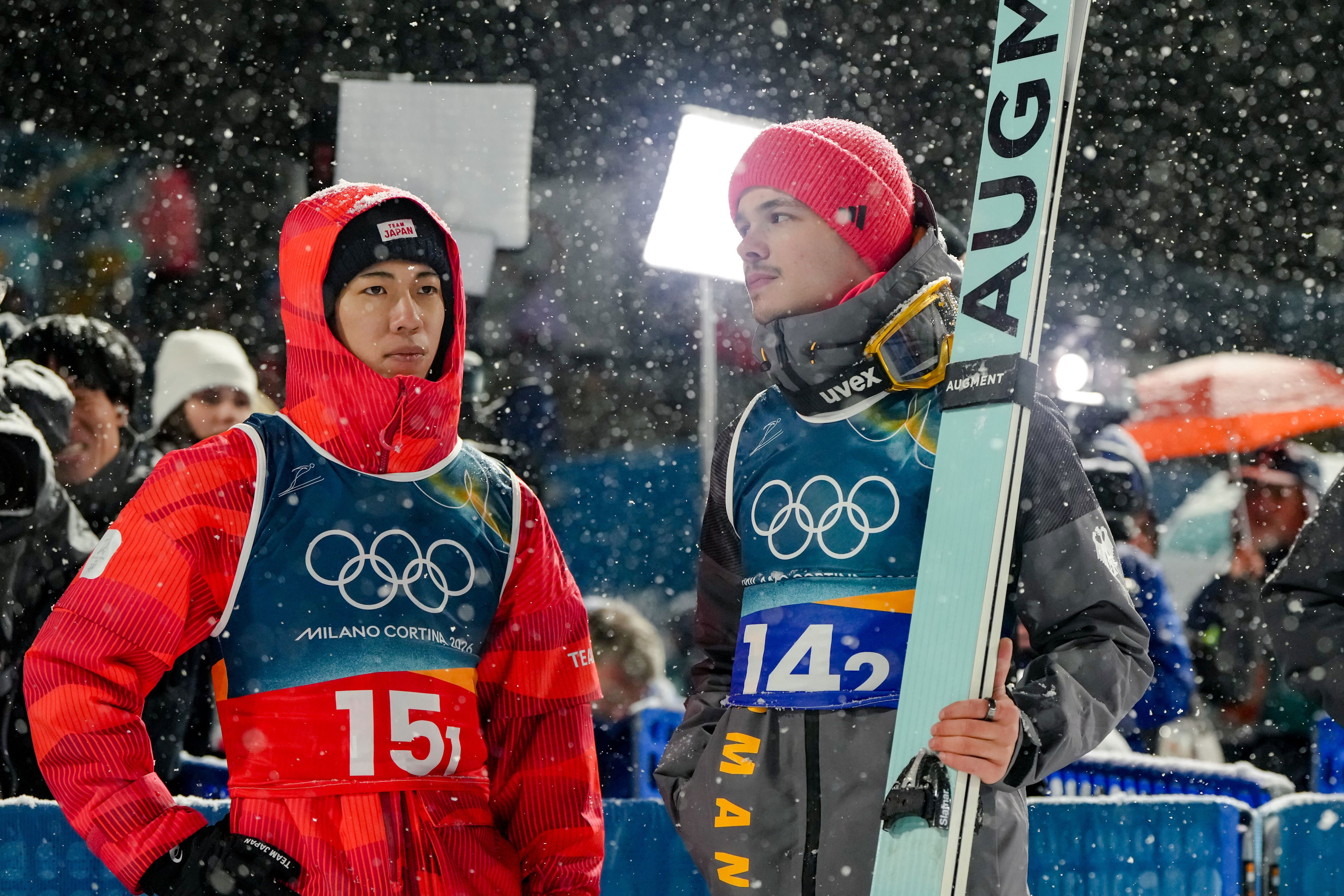 Heavy snow halts Olympic ski jumping, sparks fairness row